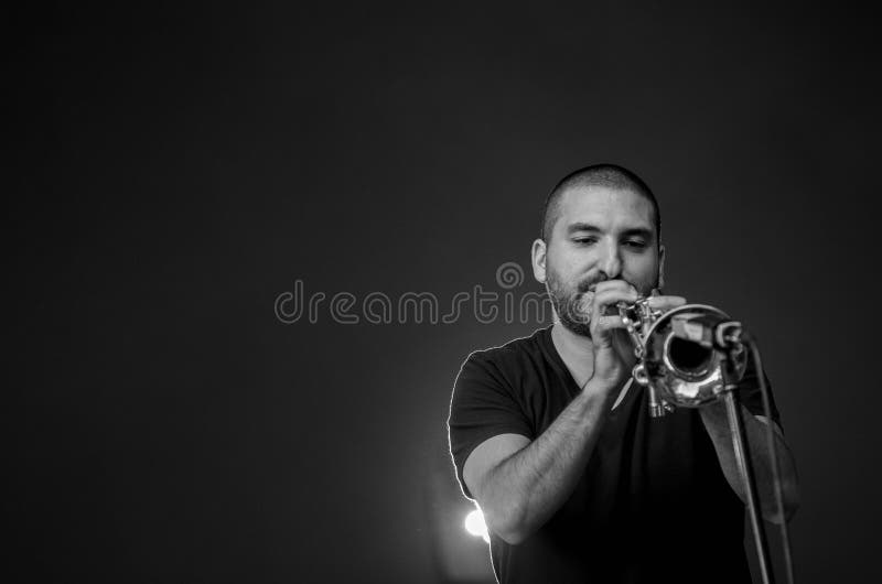 Man Playing Trumpet stock image. Image of ibrahim, blackandwhite - 82947079