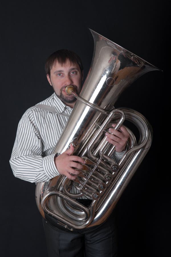 Man playing a tuba stock image. Image of male, musician - 21103765