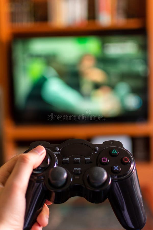 Man Playing with a Video Game Controller in His Hands. Focus on the ...