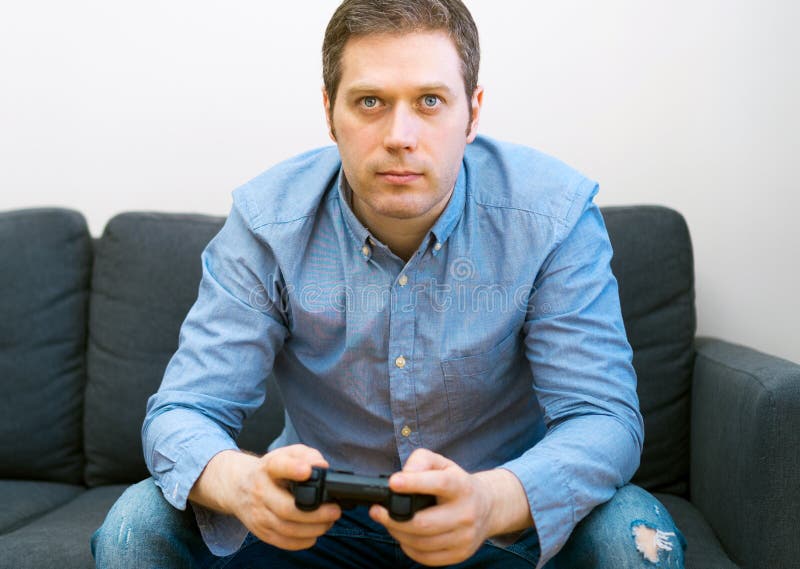 Man playing video game. stock photo. Image of equipment - 144988594