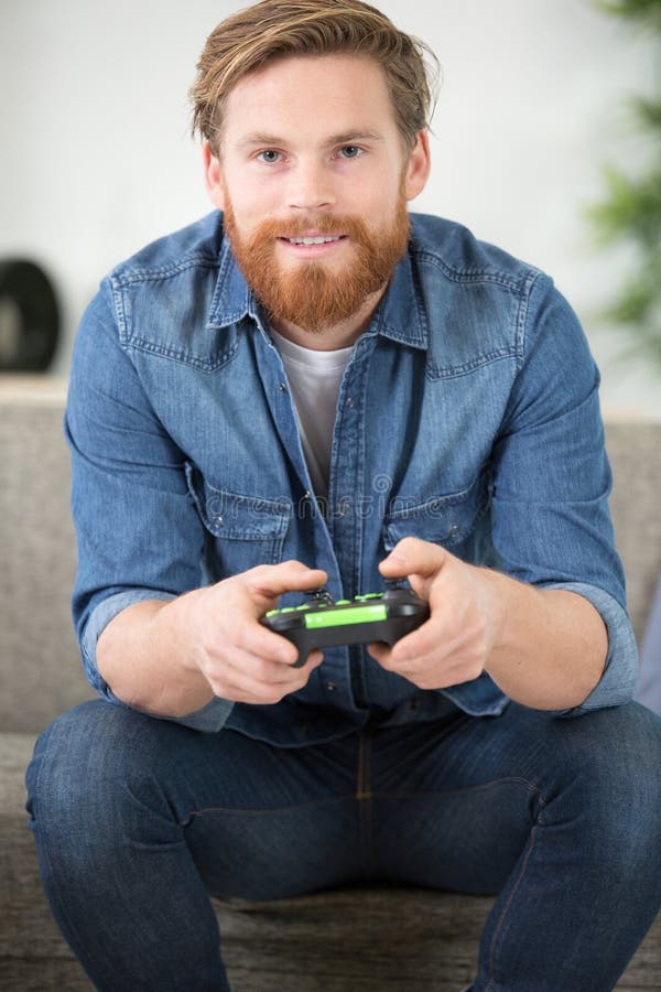 Man playing video games stock photo. Image of leisure - 286470334