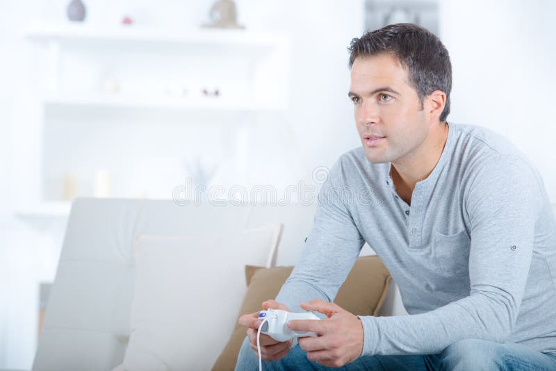 Man Playing Video Games Alone Stock Photo - Image of european, single ...