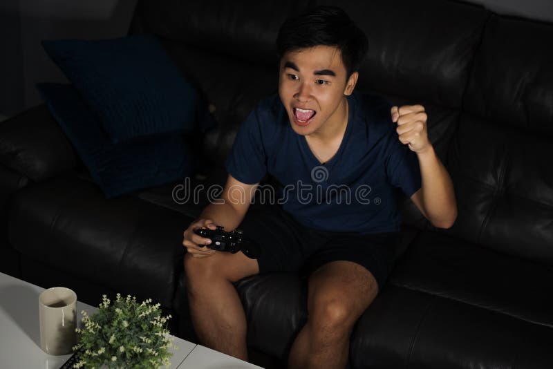 Man Playing Video Games and Wins at Night Stock Image - Image of ...