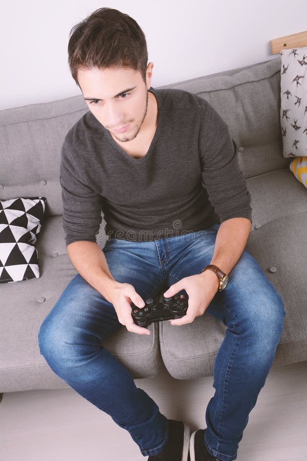 Man playing videogames. stock image. Image of gamer, house - 97915513