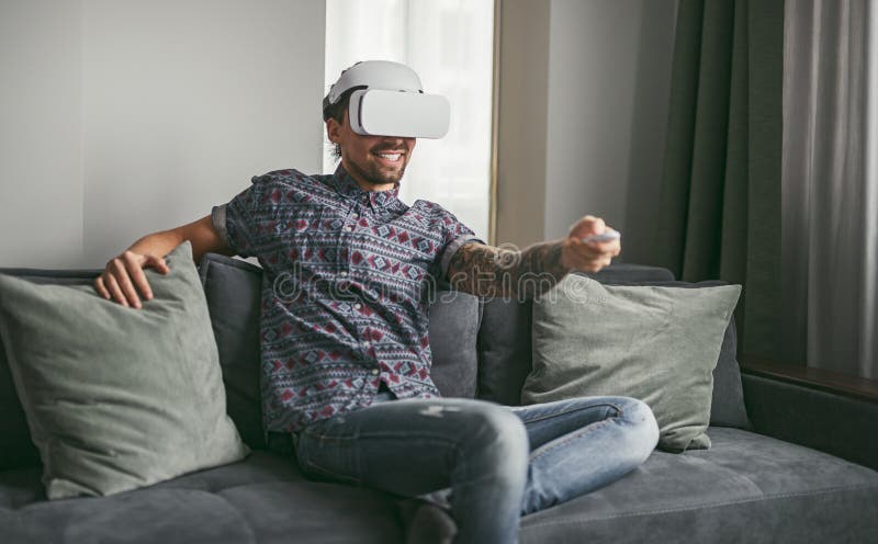 Man Playing VR Game on Couch with Controller Stock Image - Image of ...