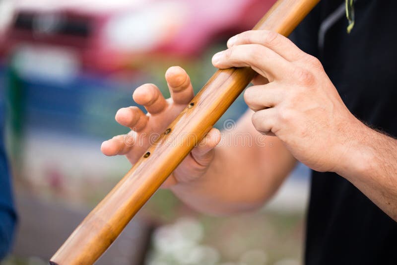 The Man is Playing on a Wooden Pipe Stock Image - Image of finger ...