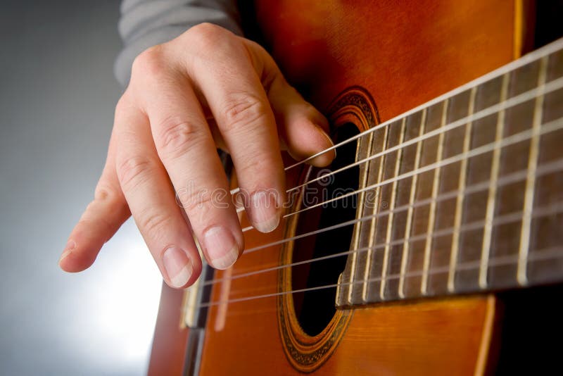 Hands of the Musician Playing on Classical Guitar Stock Image - Image ...