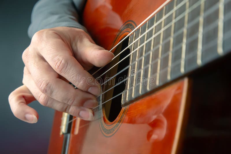 Hands of the Musician Playing on Classical Guitar Stock Image - Image ...