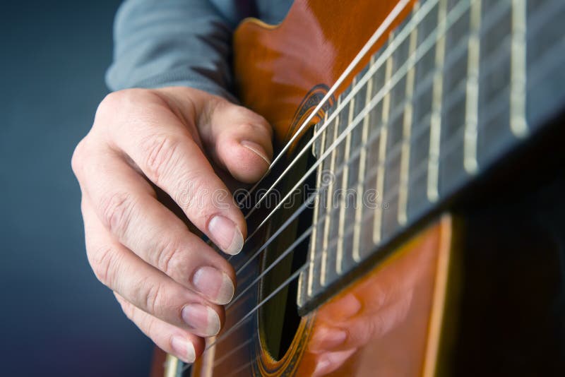 Hands of the Musician Playing on Classical Guitar Stock Image - Image ...