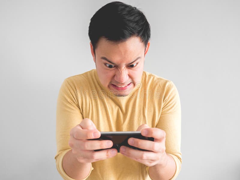 Man plays game furiously. stock photo. Image of negative - 86505204