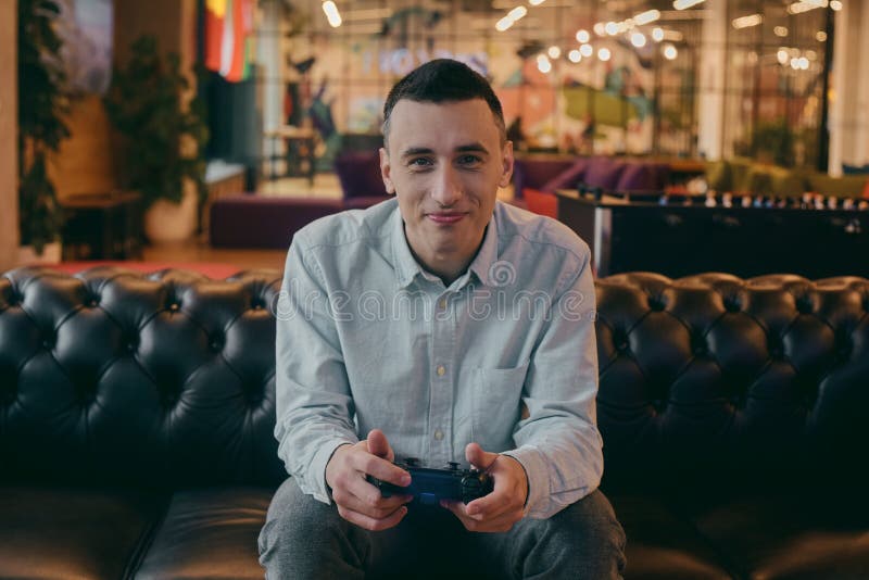 A Man Plays Games, Holds a Joystick in His Hands. a Console Game, a Guy ...