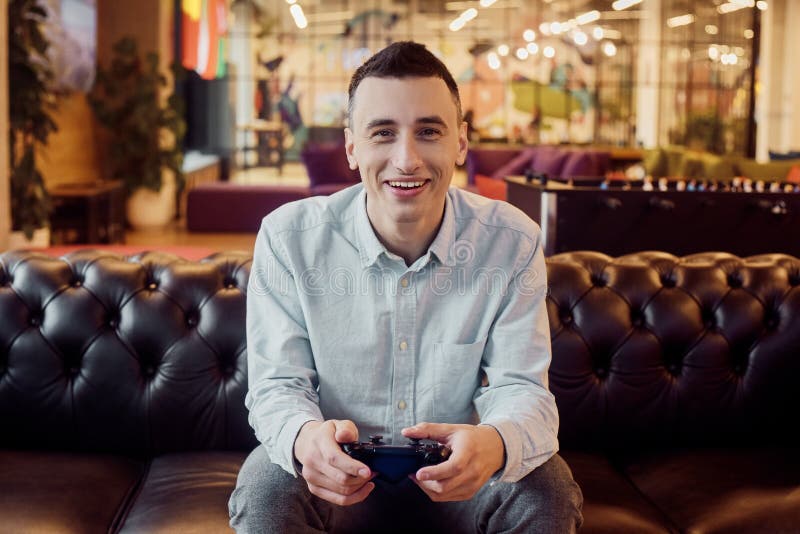 A Man Plays Games, Holds a Joystick in His Hands. a Console Game, a Guy ...