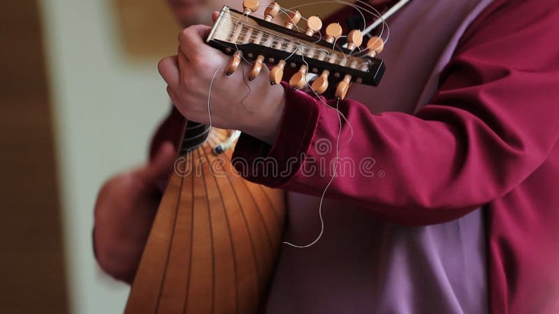 A Man Plays the Lute. Ancient Stringed Musical Instrument Stock Footage ...
