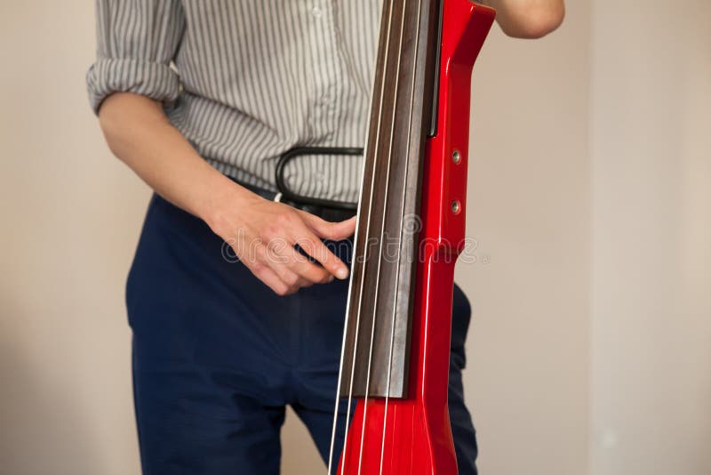 Man Plays Red Electric Contrabass Stock Photo - Image of doublebass ...
