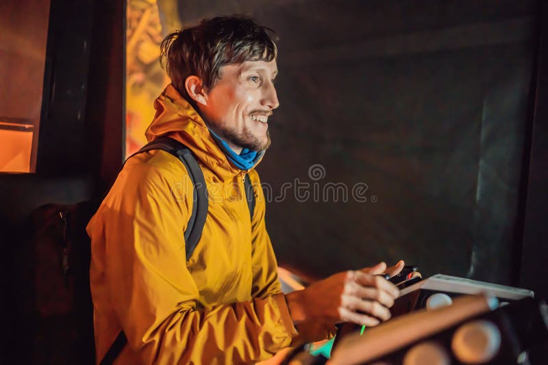 A Man Plays a Slot Machine, Holds the Wheel Stock Photo - Image of ...