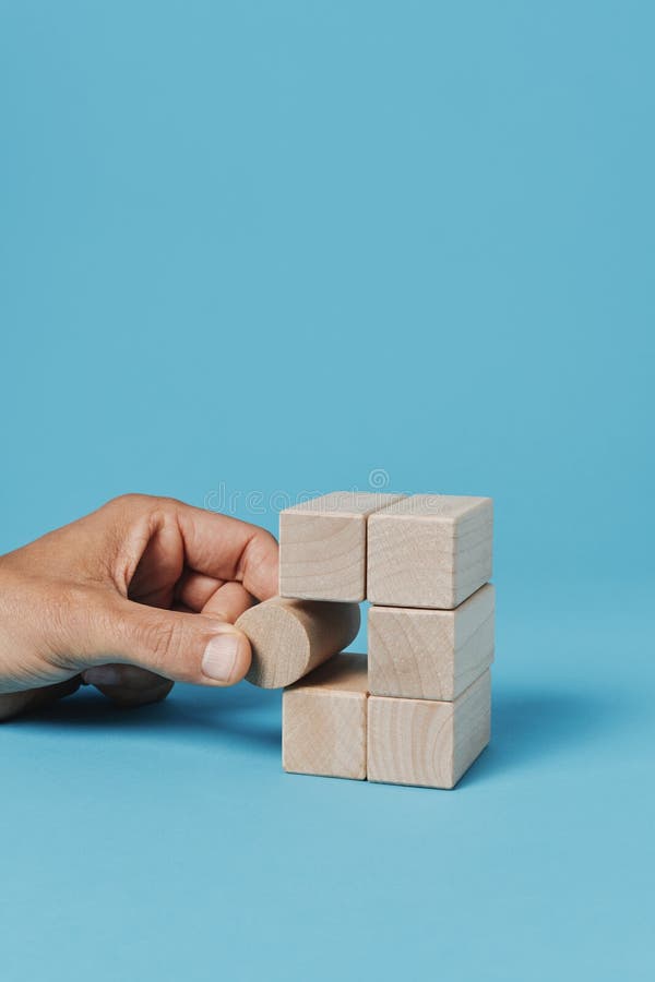 Man plays with toy blocks stock image. Image of discordant - 279569511
