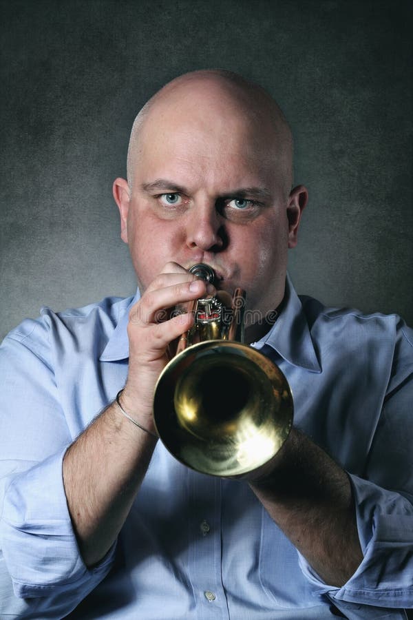 Man plays a trumpet stock photo. Image of focused, sound - 30432146
