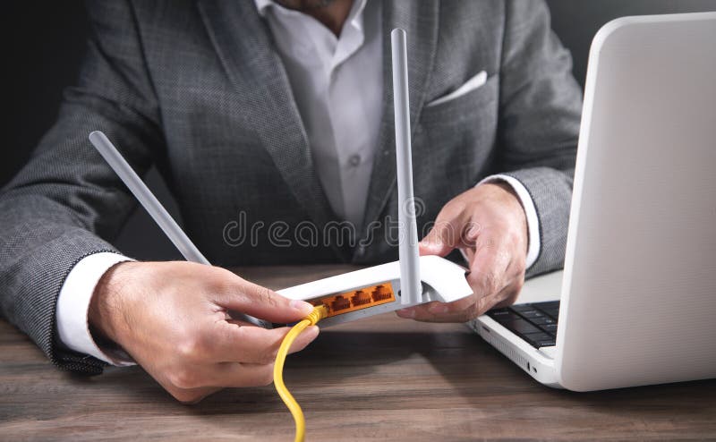 Man Plugging Internet Cable into Wifi Router Stock Image - Image of ...