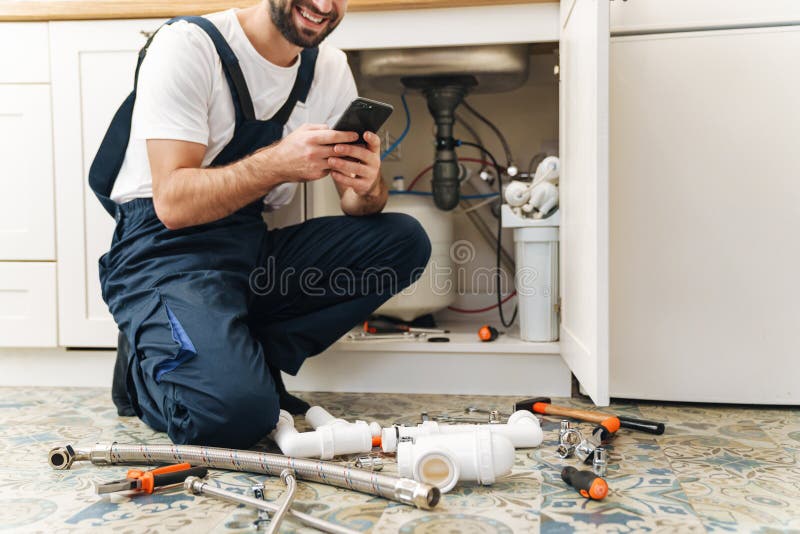 Man Plumber Work in Uniform Indoors Using Mobile Phone Stock Image ...