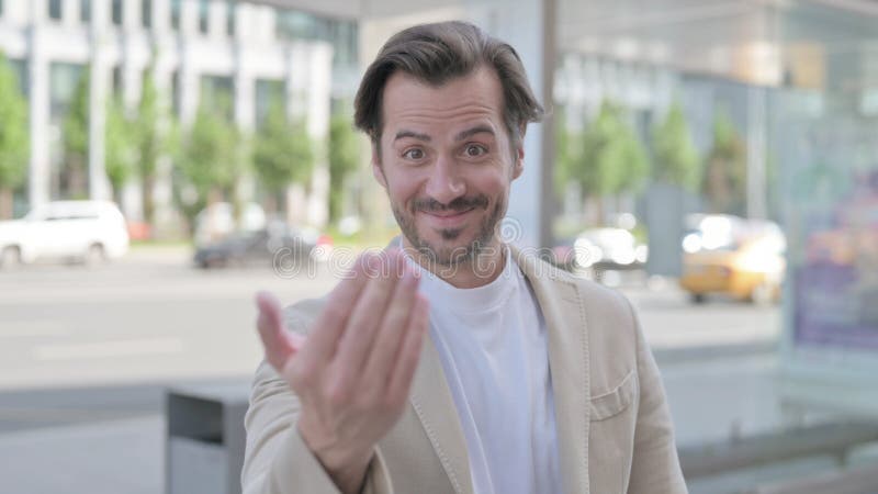 Young Man Pointing at the Camera and Inviting Outdoor Stock Image ...