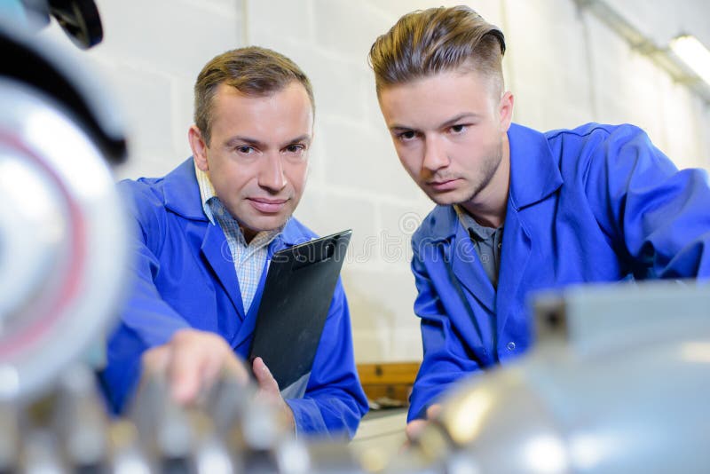 Man pointing at defect stock photo. Image of mentor - 196841716