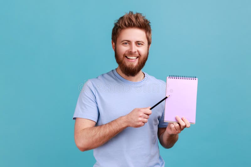 Man Pointing Empty Sheet and Smiling at Camera, Showing Paper Notebook ...