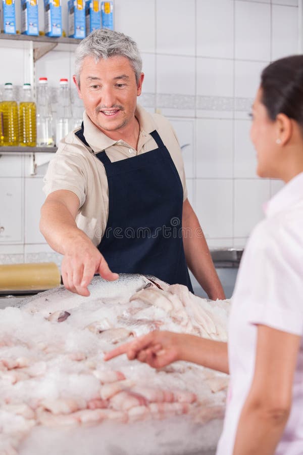 Man pointing a fish stock image. Image of market, seller - 65089973