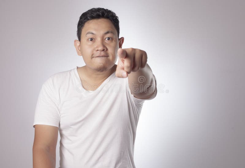 Man Pointing Forward, Looking at Camera Stock Photo - Image of happy ...