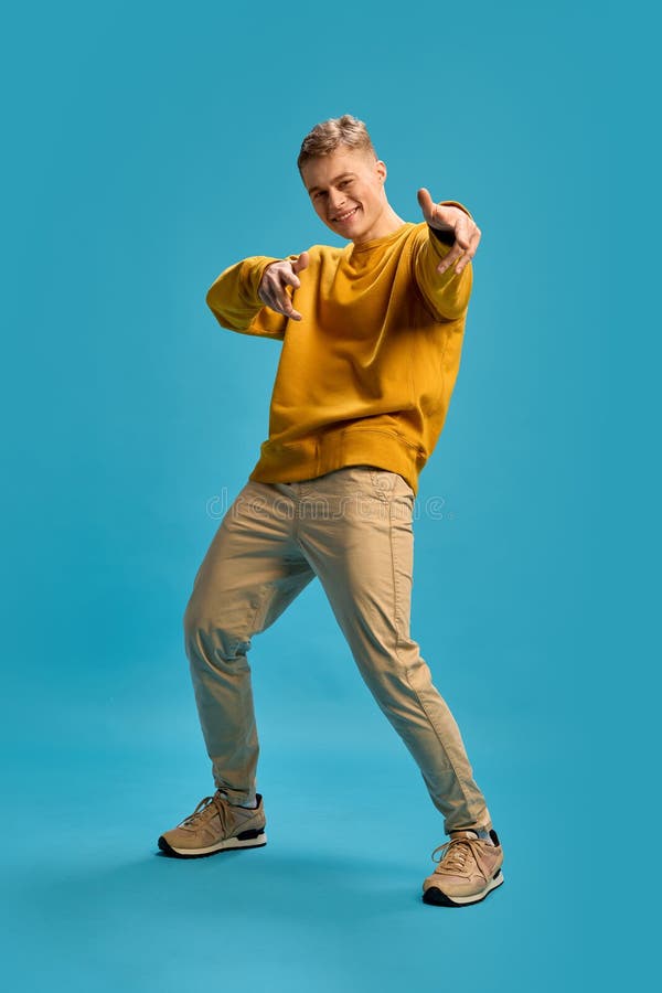 Man Pointing Forward with Playful Smile, Leaning Slightly, Engaging ...