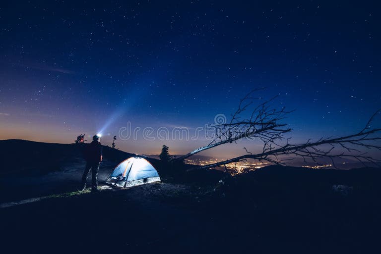 Man Pointing Light from His Flashlight To the Sky. Stock Image - Image ...