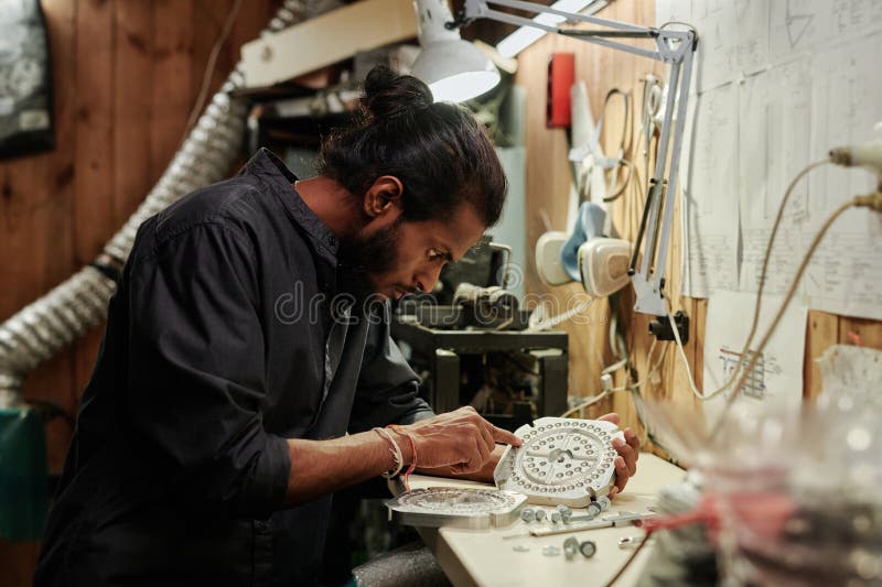 Man Pointing at Press Mold by Workbench Stock Photo - Image of ...