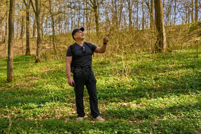 Man Pointing in Spring Forest Stock Image - Image of wilderness ...