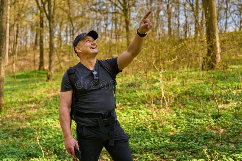 Man Pointing in Spring Forest Stock Image - Image of sunlight, peaceful ...