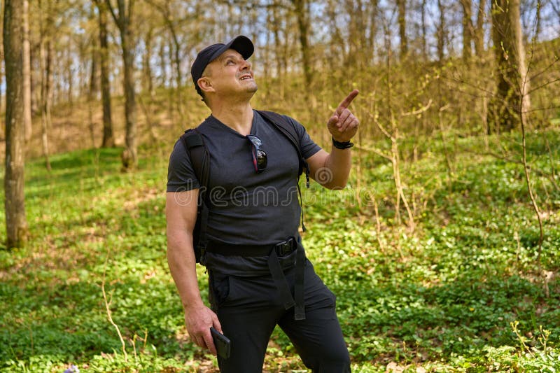 Man Pointing in Spring Forest Stock Image - Image of nature, lifestyle ...