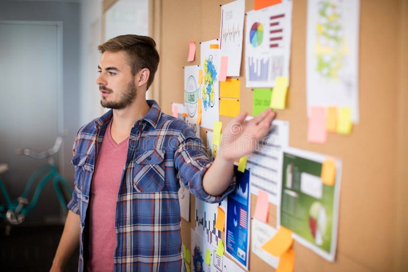 Man Pointing at Sticky Notes on the Board Stock Photo - Image of ...