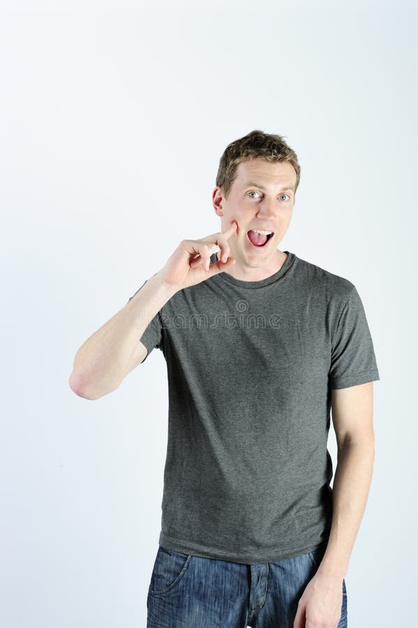 Man Pointing to Cheek stock photo. Image of white, point - 10446374