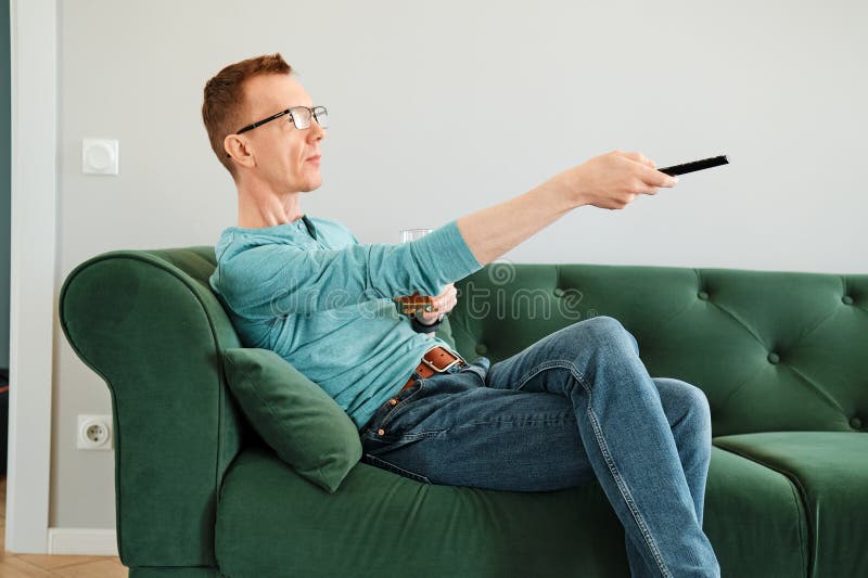 Man Pointing Tv Remote Control Sitting on Sofa in Living Room Stock ...