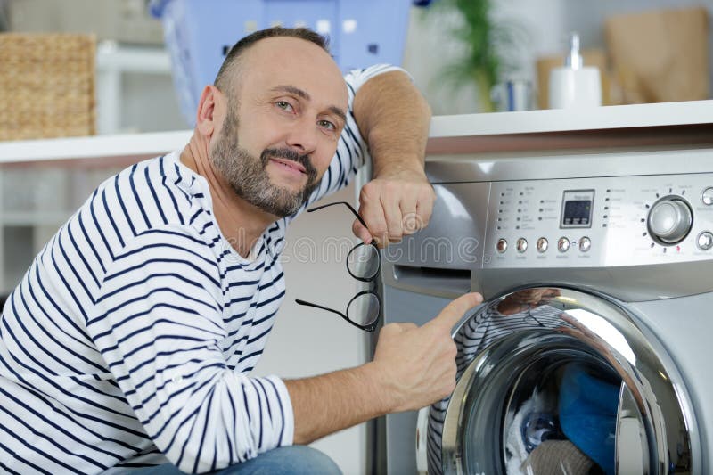 Man Pointing Washing Machine Stock Photo - Image of laundry ...