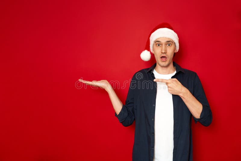 Man Points His Index Finger at Palm Up, Highlighting an Empty Free ... Man Points His Index Finger at Palm Up, Highlighting an Empty Free ...