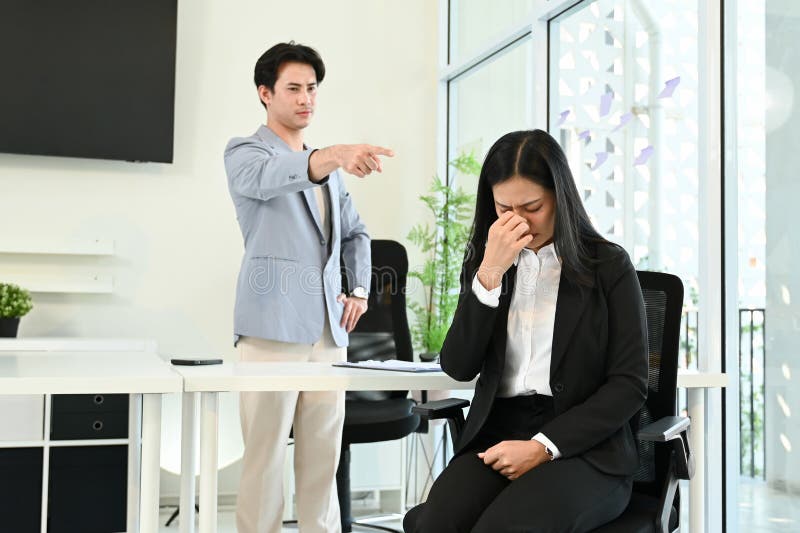A Man Points at a Woman Who is Crying in a Business Setting Stock Image ...