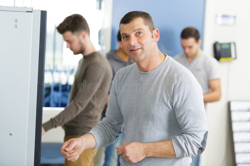 Man Poised To Put Coin into Vending Machine Stock Image - Image of ...