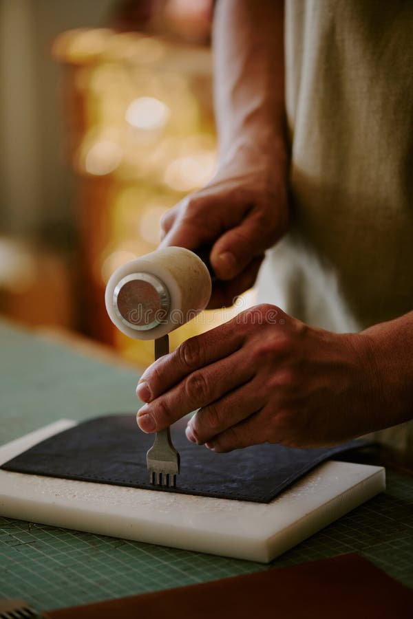 Man Poking Leather Piece stock image. Image of handmade - 328702321
