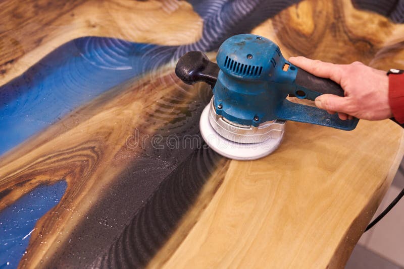Man Polishing Epoxy Table Close Up Stock Photo - Image of glass ...