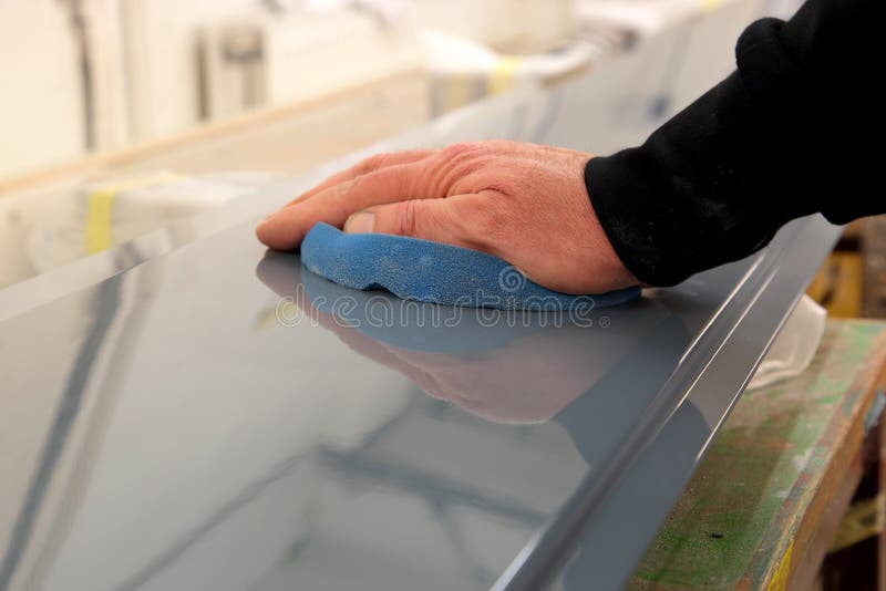 Man Polishing a Painted Metal Panel with a Blue Foam Pad Stock Image ...