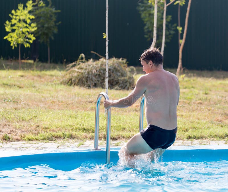 Man in the Pool on the Stairs Stock Image - Image of swimming ...