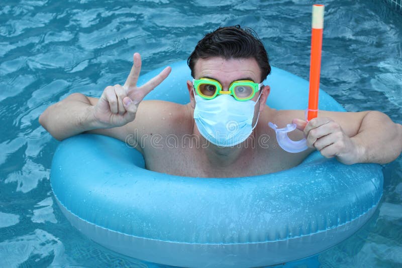 Man in the Pool with Surgical Mask Holding Warning Sign Stock Photo ...
