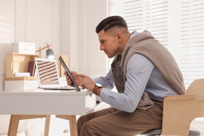 Man with Poor Posture Using Laptop on Sofa at Home Stock Image - Image ...