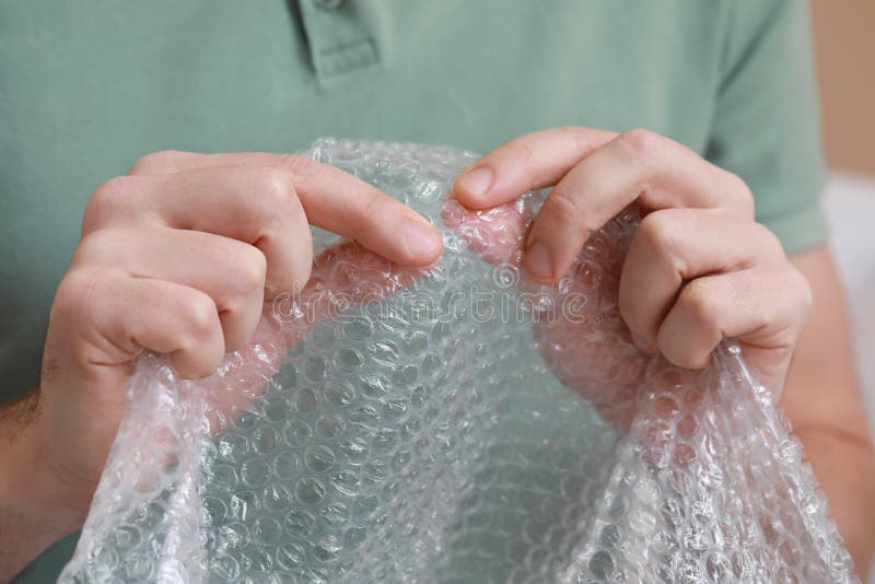 Man Popping Bubble Wrap, Closeup View. Stress Relief Stock Photo ...
