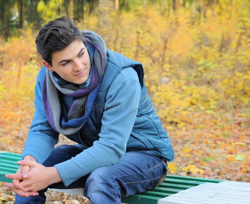 Man Portrait Sitting in Autumn Park on a Bench. Stock Photo - Image of ...