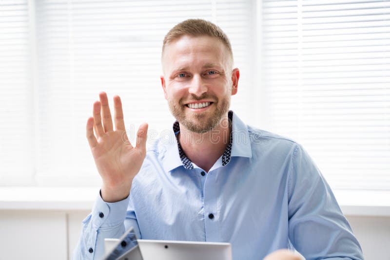 Man Portrait Waving Hello stock image. Image of confident - 215617291